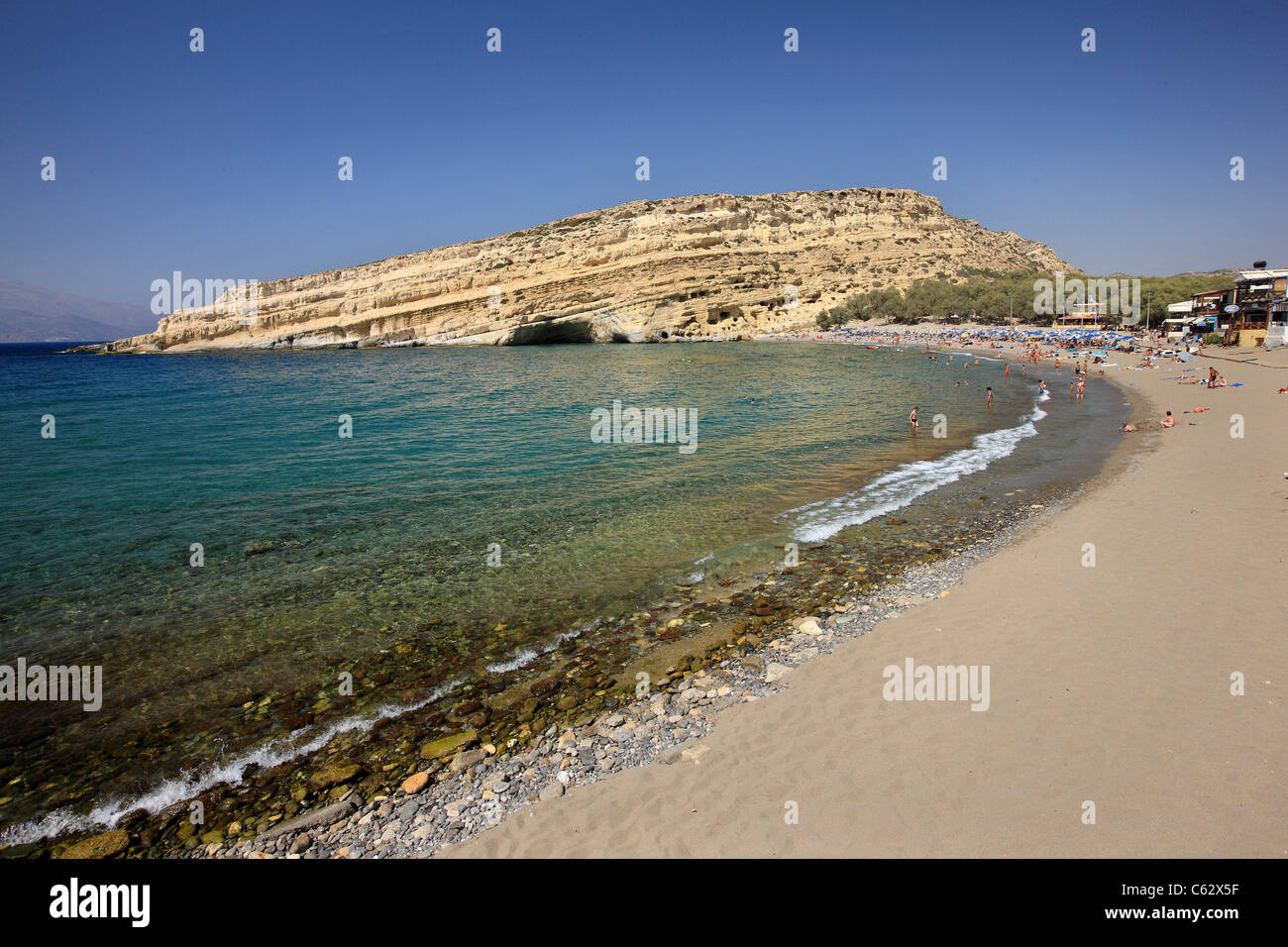Matala beach with its famous caves, once "home" for many hippies, to ...