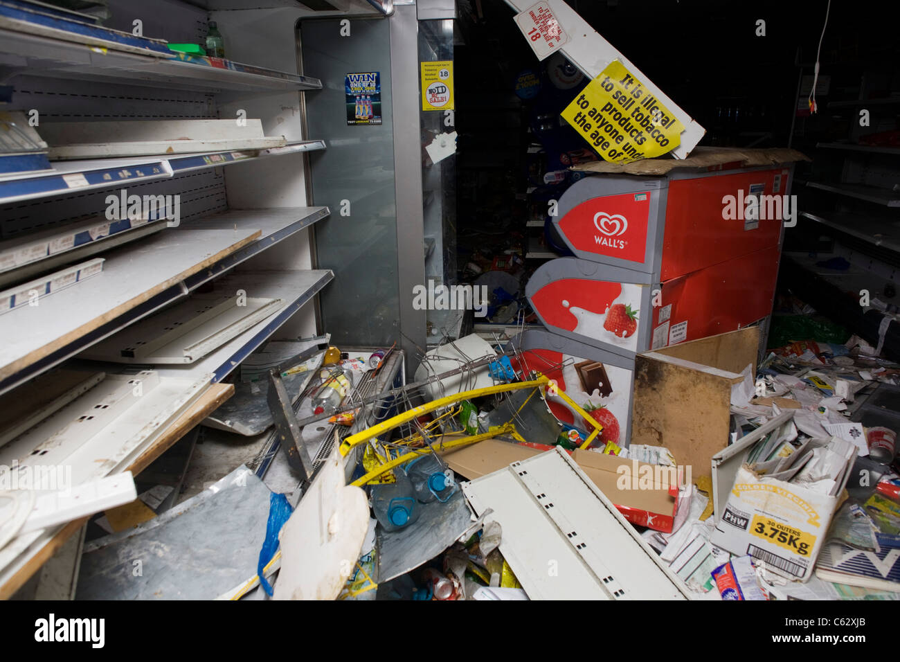The damage and detritus of shop stock in the damaged Clarence Road ...
