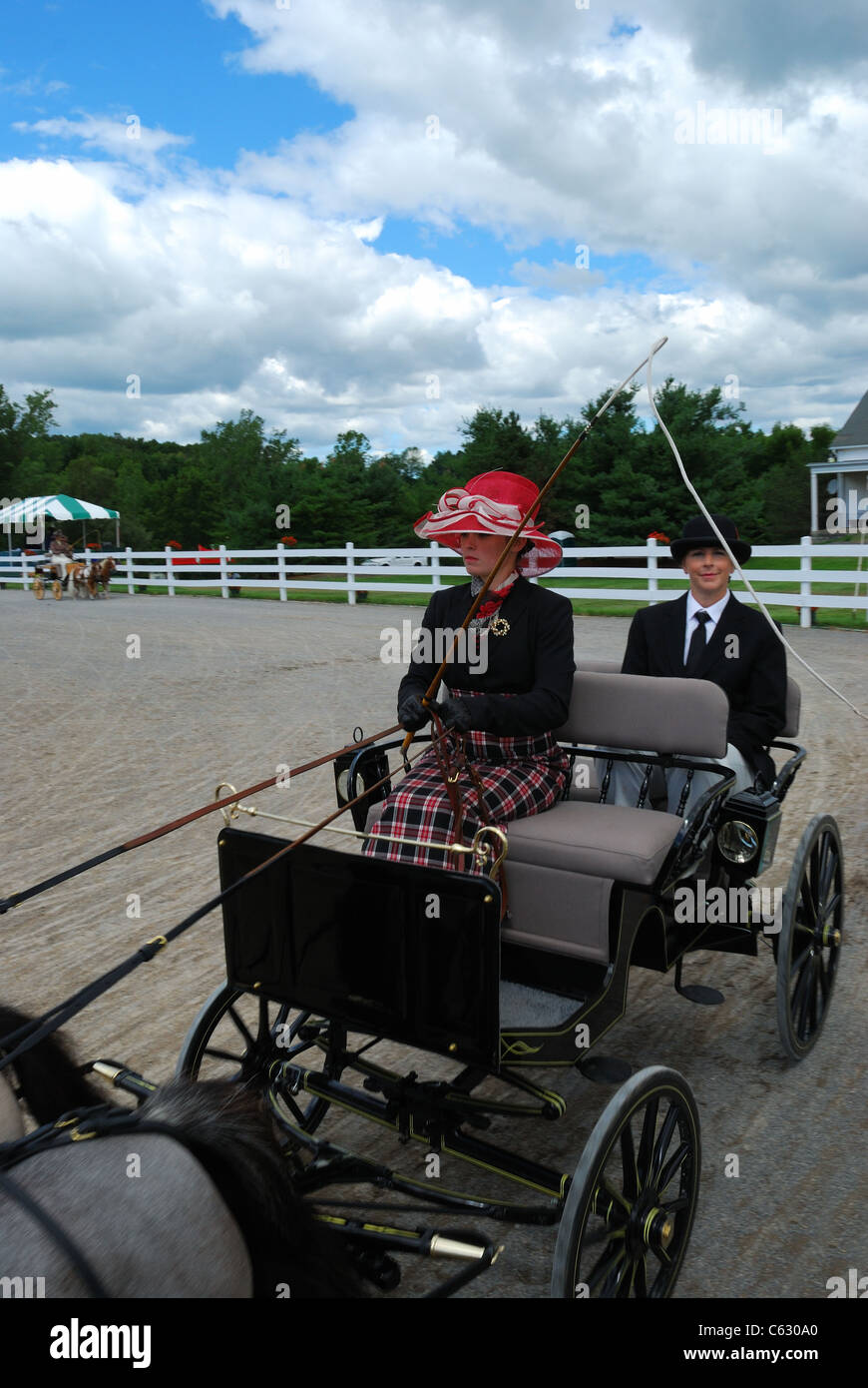 Carriage driver and passenger at Walnut Hill Farms annual carriage ...