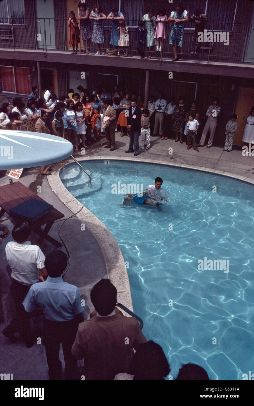 Baptism ceremony held in an outdoor pool in California USA in 1975 ...