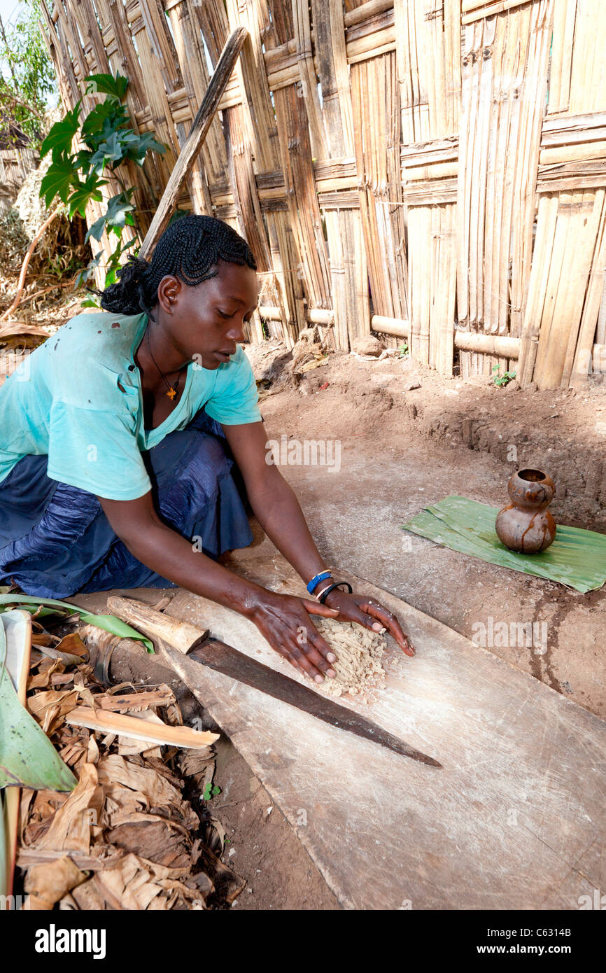 A Dorze tribeswoman making Enset an unleavened bread at the village of ...