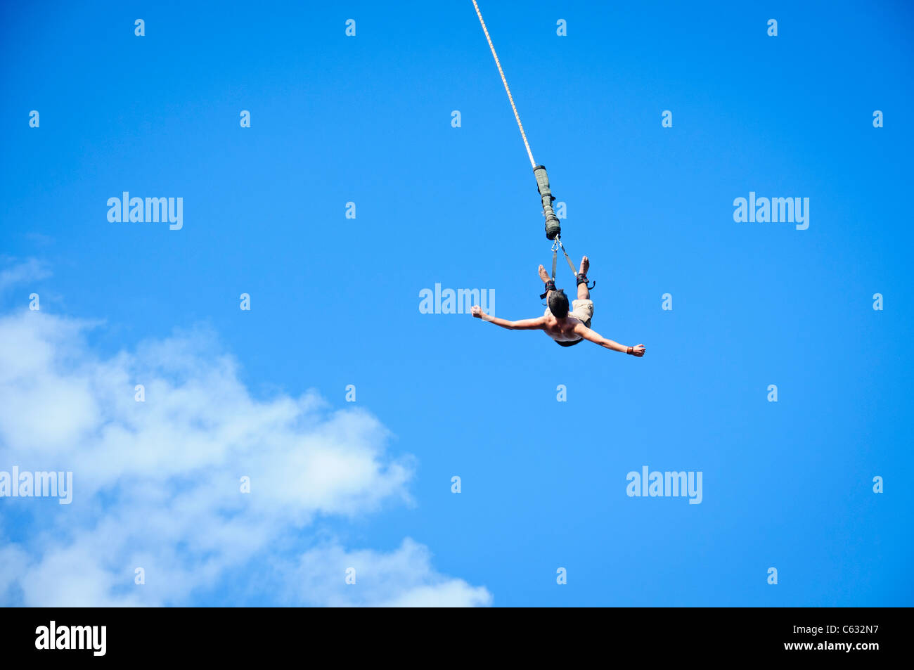 young man Bungee Jumping at Woodstock festival in Kostrzyn, Poland ...
