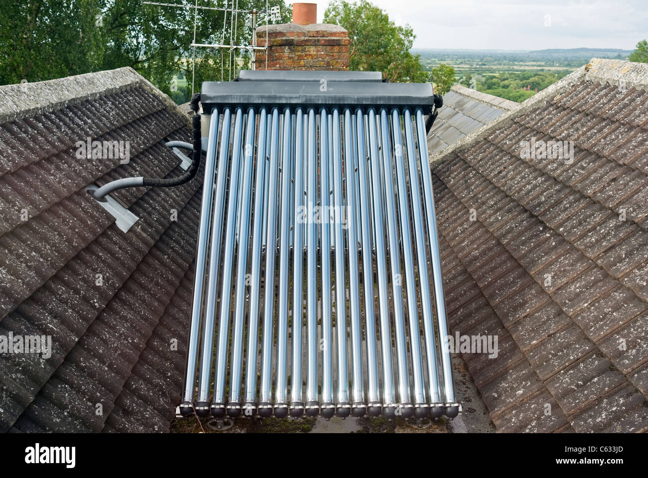 Solar heating panel in roof gully to minimize visibility Stock Photo ...