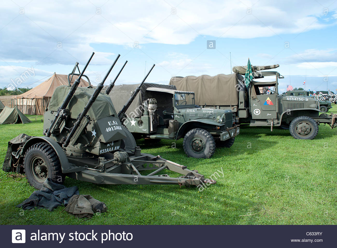 Anti aircraft gun and world war two American army trucks at a Stock ...
