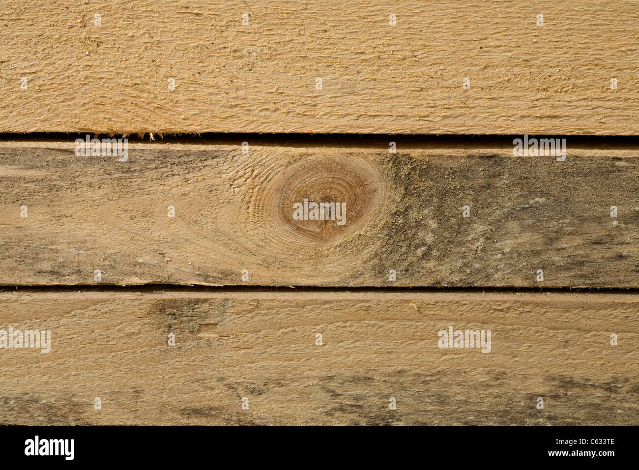 Stack of Building Lumber at Construction Site. Close up view of stacked ...