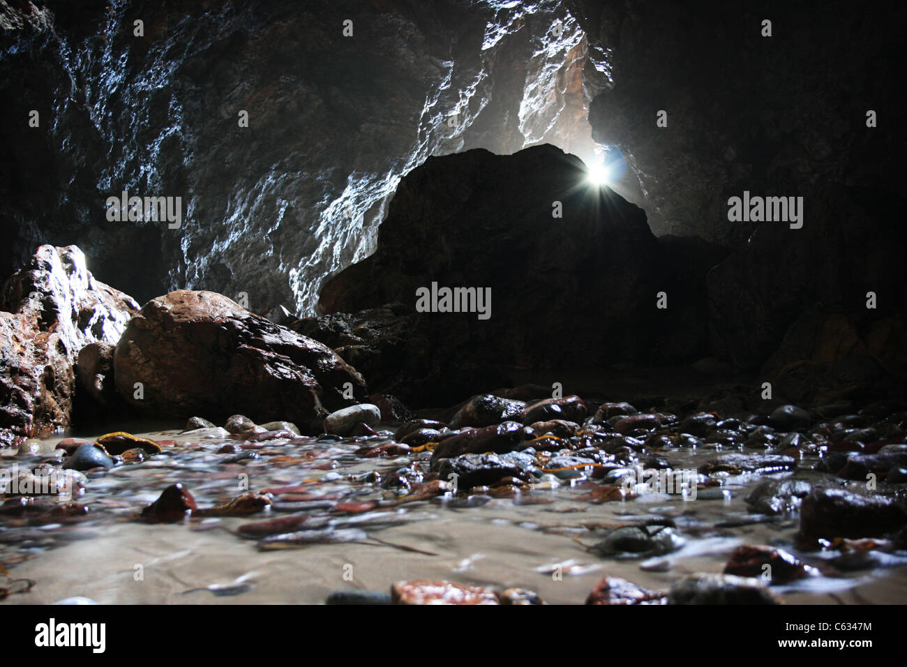 Light through the rocks in the cave Stock Photo - Alamy