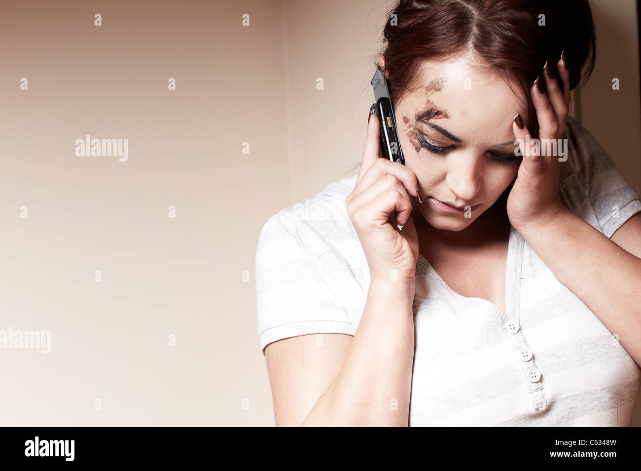 Abused woman calling for help Stock Photo - Alamy