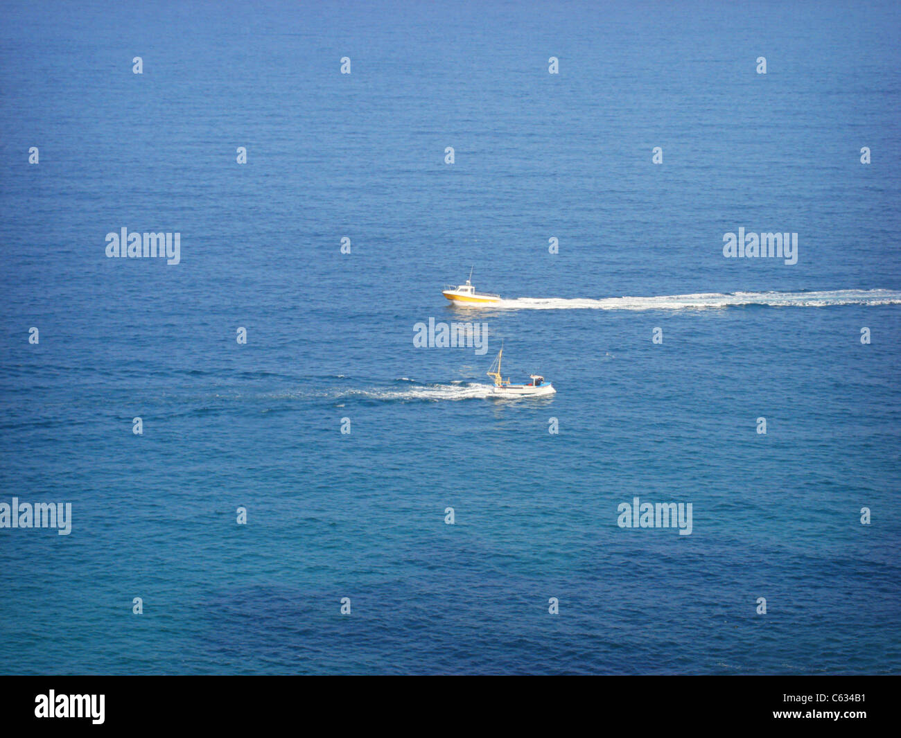 Two boats driving past each other in the sea Stock Photo - Alamy