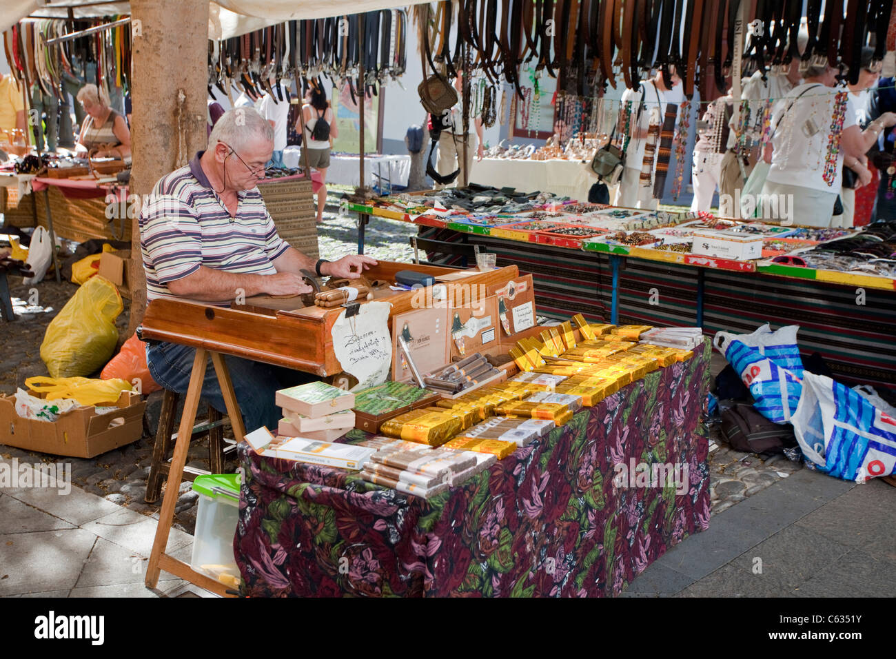 Old man rolling cigars at the market of Santa Cruz, La Palma, Canary ...