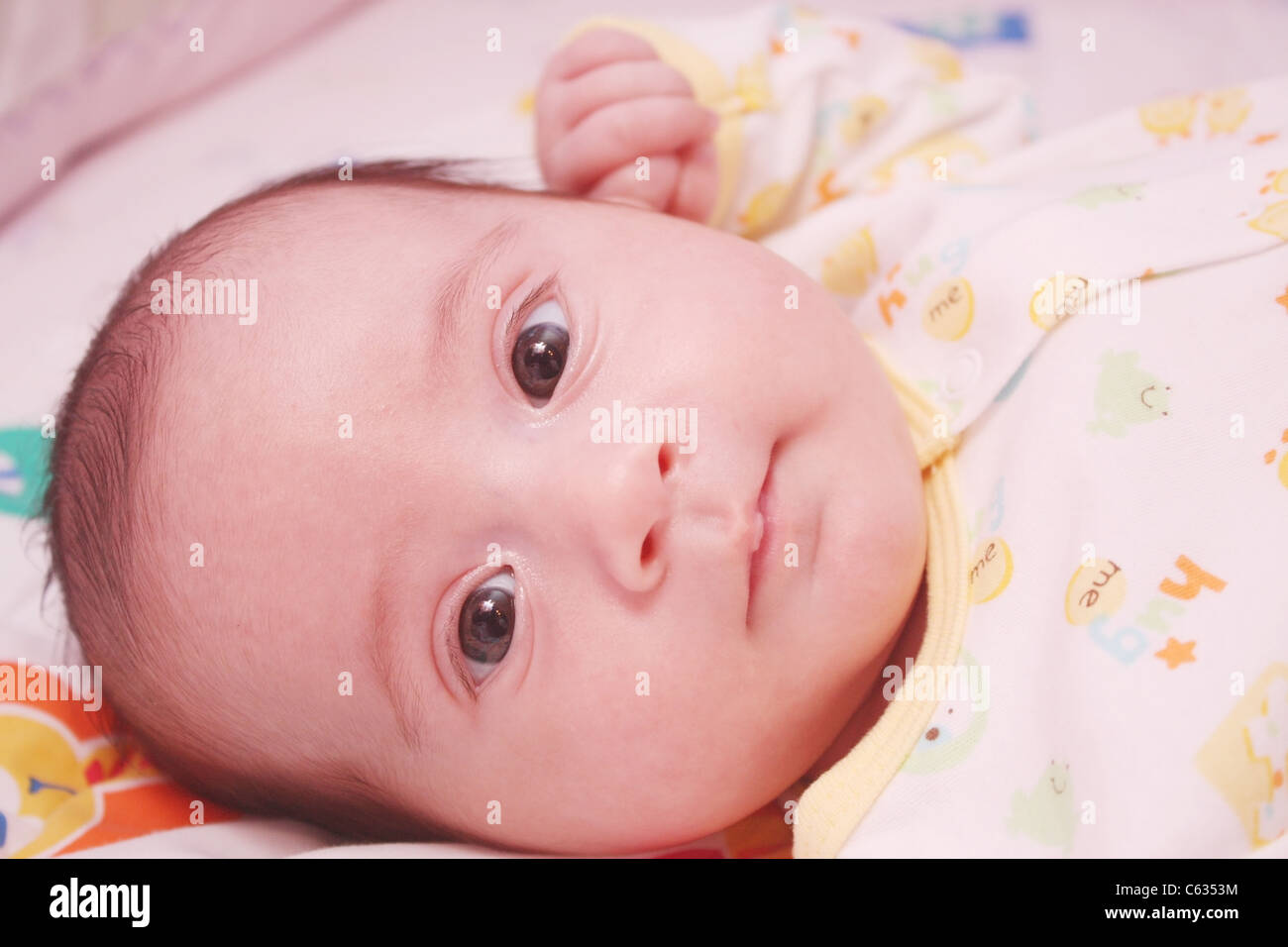 A new baby looking at camera Stock Photo - Alamy