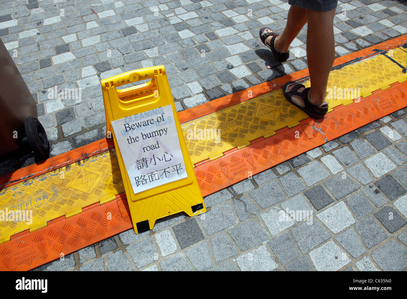 Beware of the bumpy road warning sign in Hong Kong, China Stock Photo ...