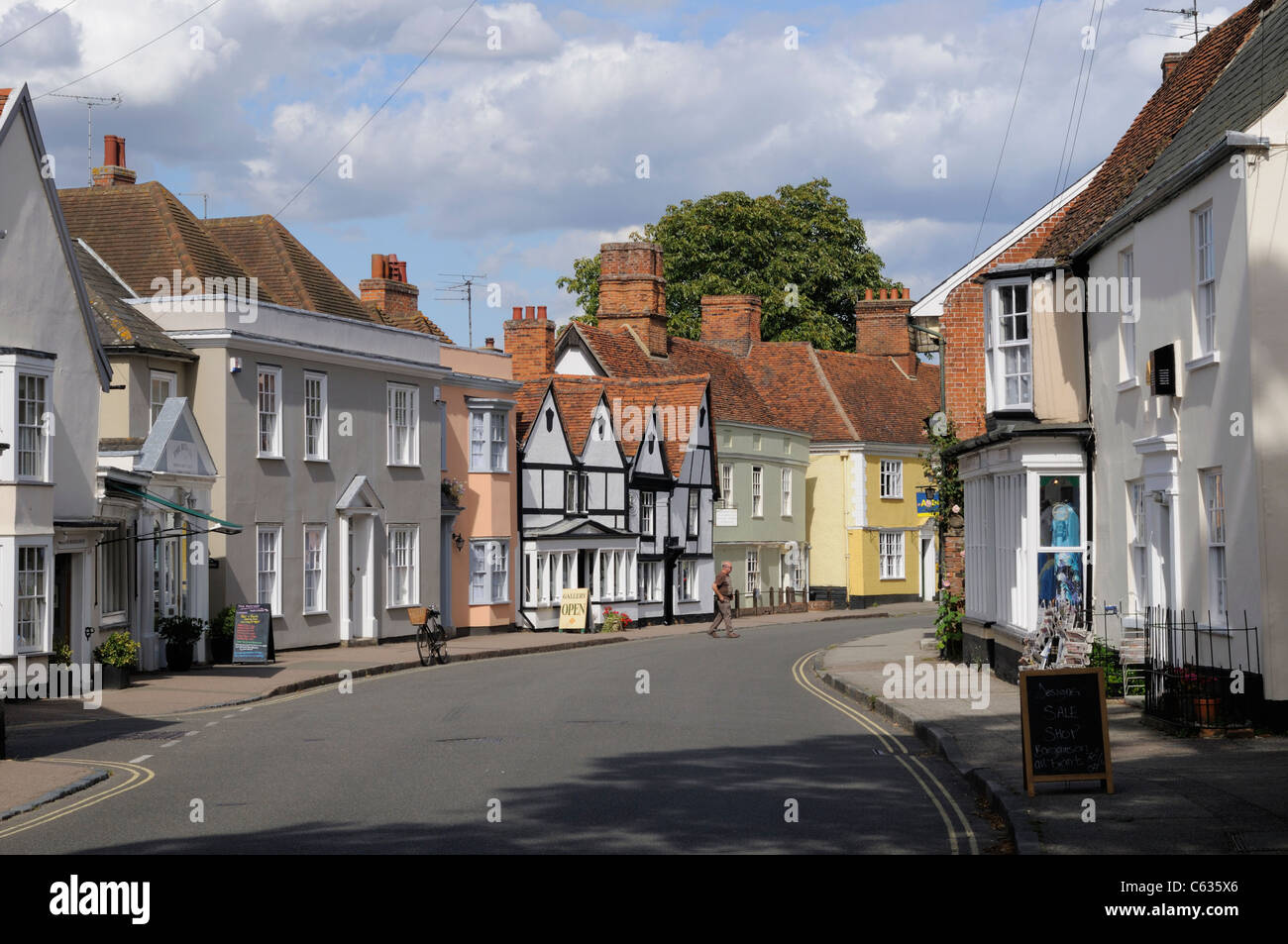 Shops lining the High Street in the village of Dedham in Essex, England ...