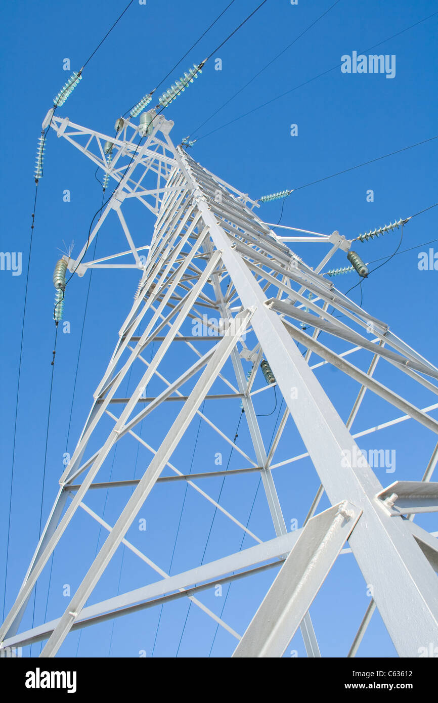 High-voltage prop against the blue sky backgrounds Stock Photo - Alamy