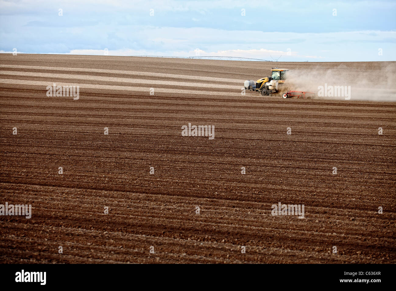 Image of a tractor plowing a field Stock Photo - Alamy
