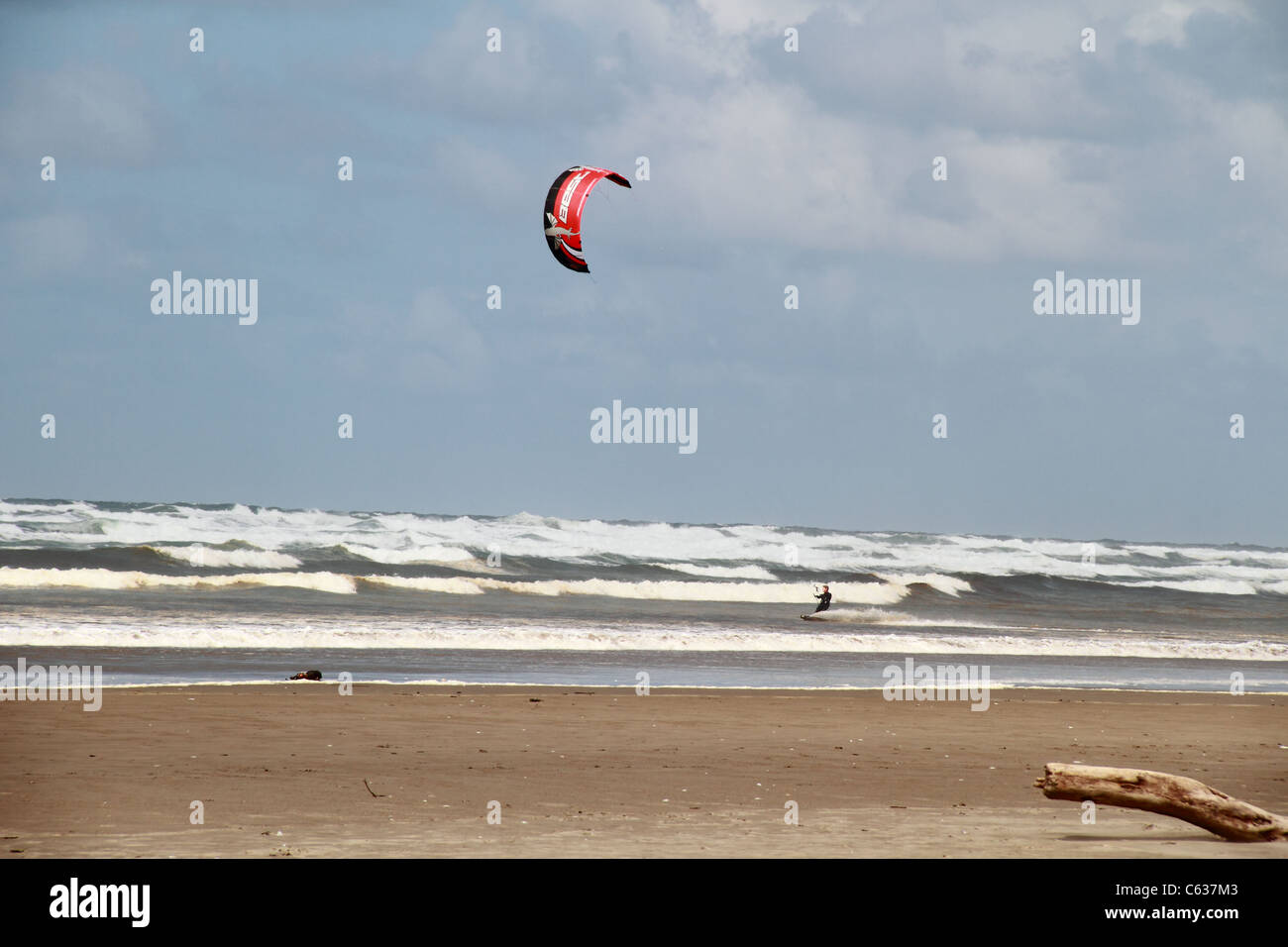 female kite surfing on the beach at Seaside, Oregon along the Pacific ...