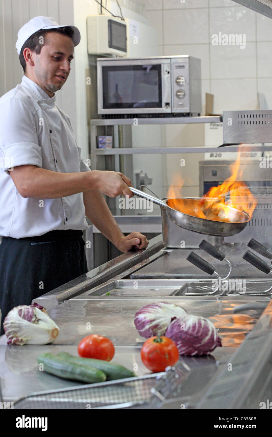 Male chef cooking flambe in hi-res stock photography and images - Alamy
