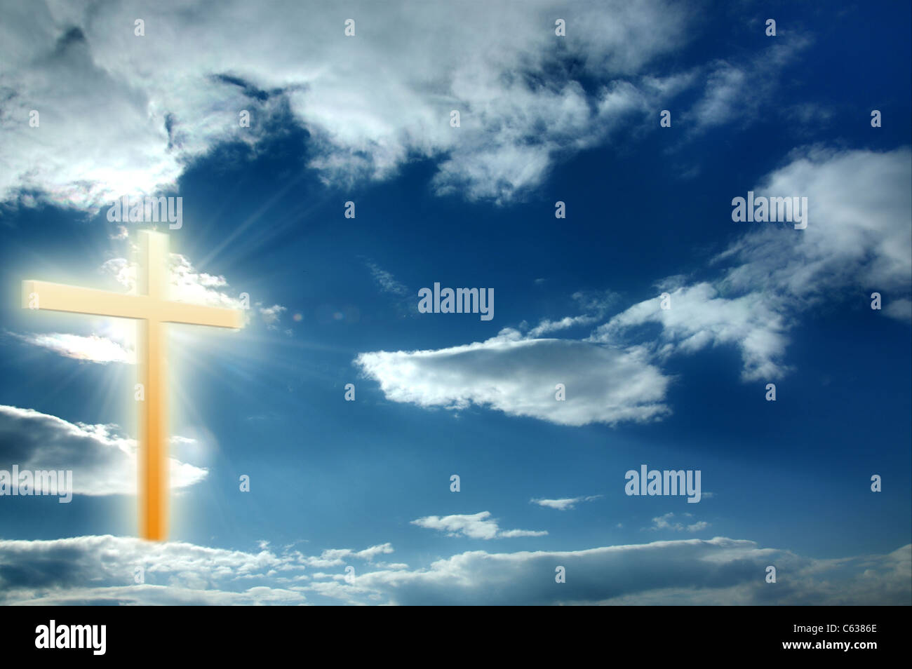 Religion cross on the blue sunny sky, heaven Stock Photo - Alamy