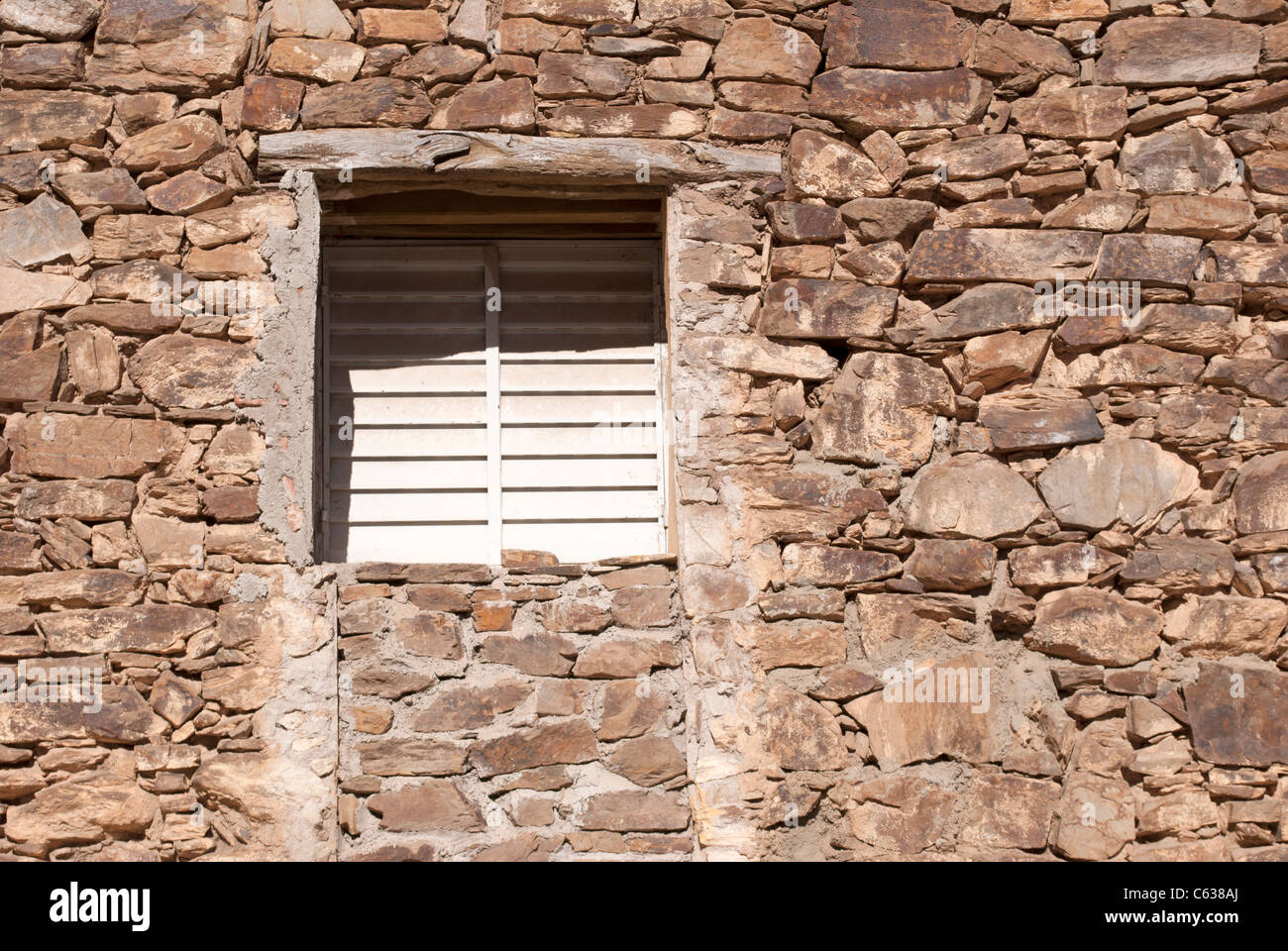 Stone wall with window Stock Photo - Alamy