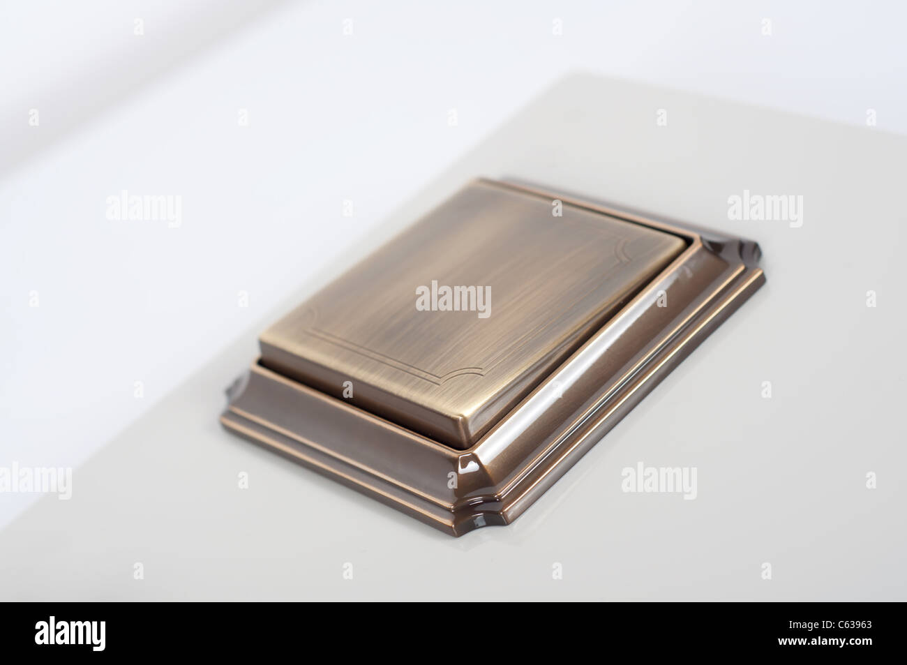 brass retro light switch on the wall Stock Photo - Alamy