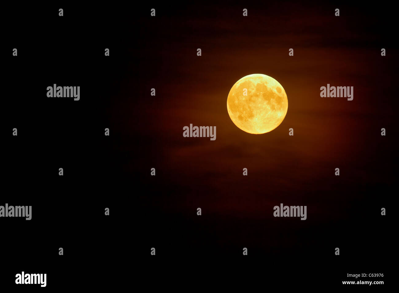 Full moon in the mist on dark night sky background Stock Photo - Alamy
