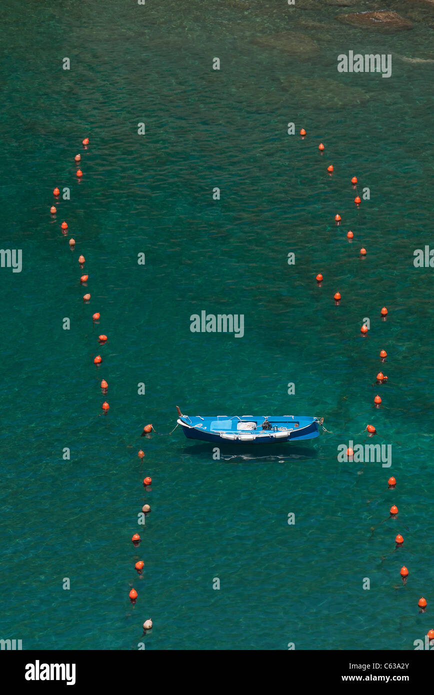 Blue rowboat buoys in sea hi-res stock photography and images - Alamy