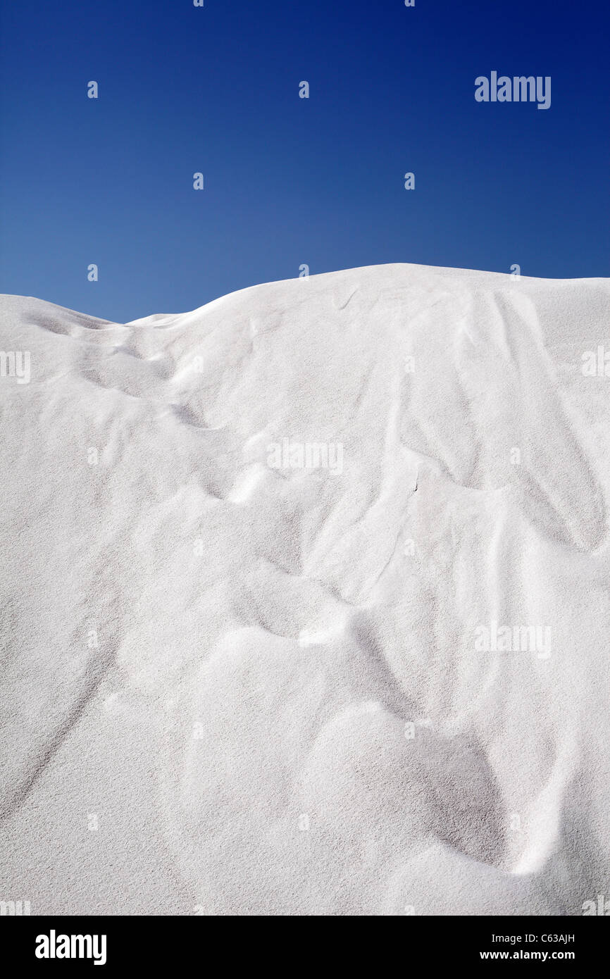White sand mound and clear blue sky Stock Photo - Alamy