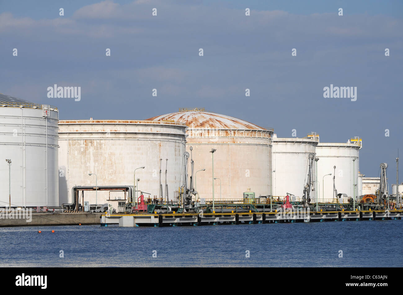 Industrial fuel storage tanks at oil refinery Stock Photo - Alamy