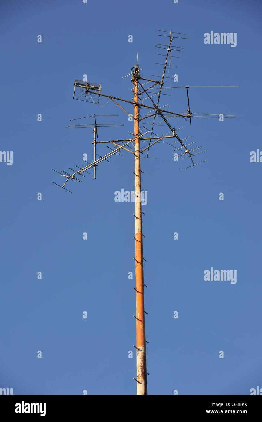 Basic television aerial / antenna against blue sky Stock Photo - Alamy