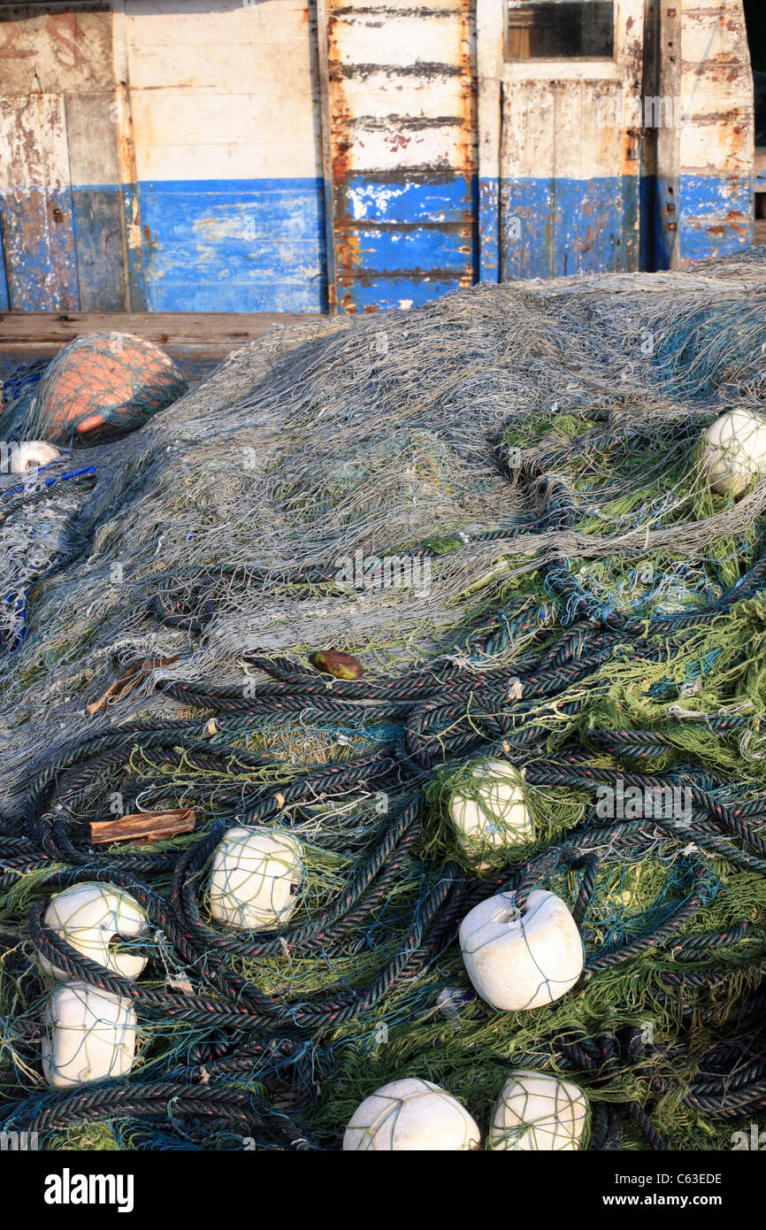 Fishing boat and fishing net at the harbour Stock Photo - Alamy