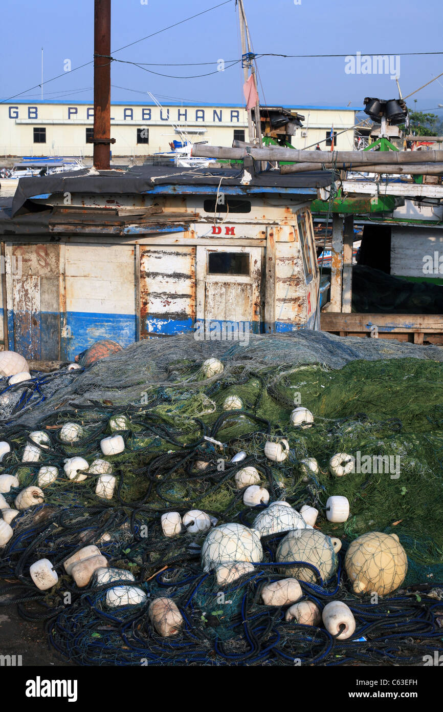 Fishing boat and fishing net at the harbour Stock Photo - Alamy