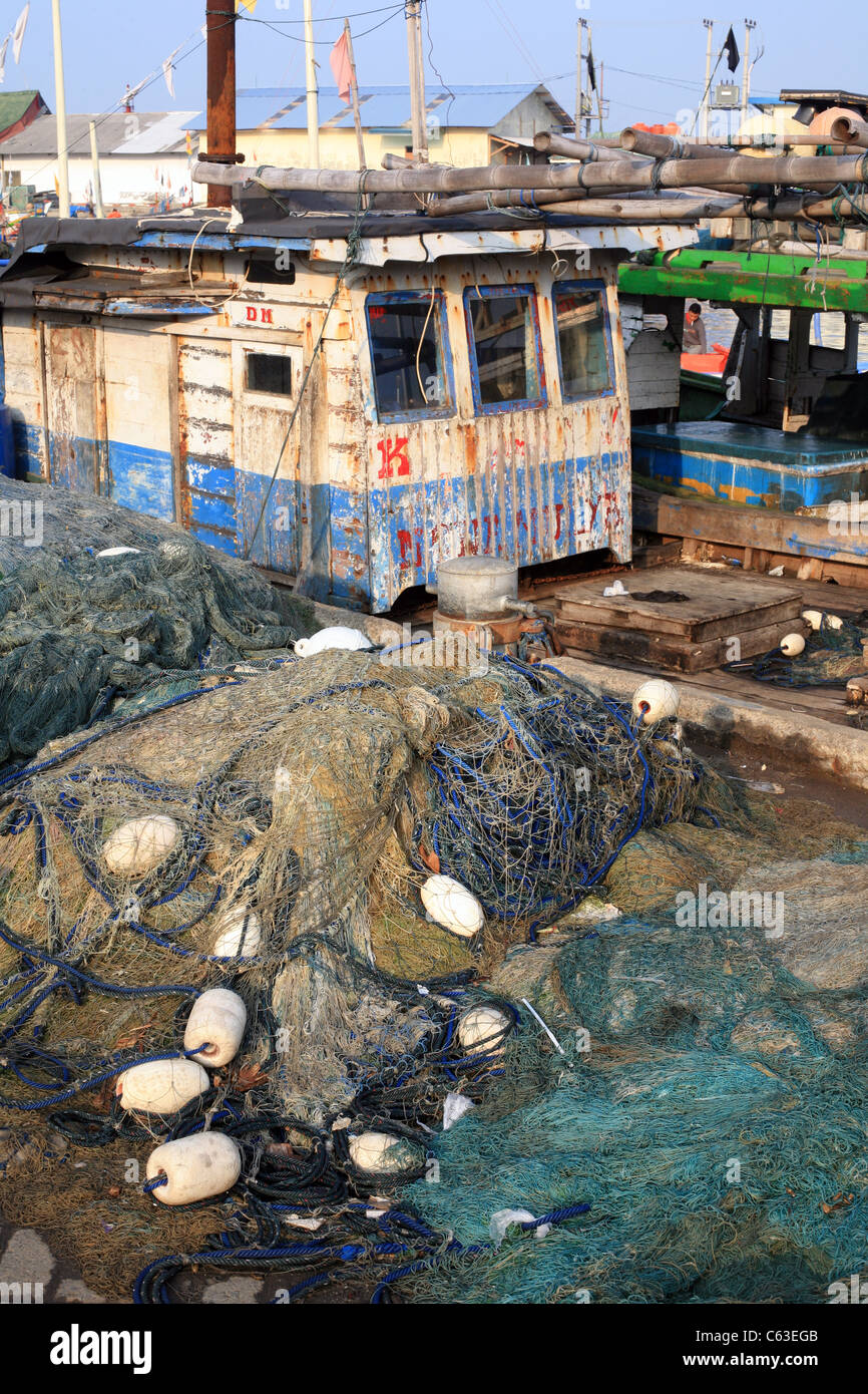Fishing boat and fishing net at the harbour. Pelabuhanratu, West Java ...