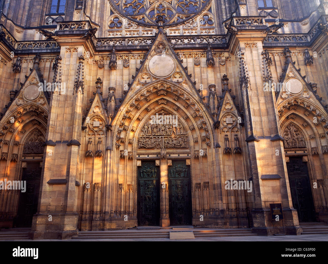 Sunrise light hitting front door and facade of St. Vitus Cathedral in ...
