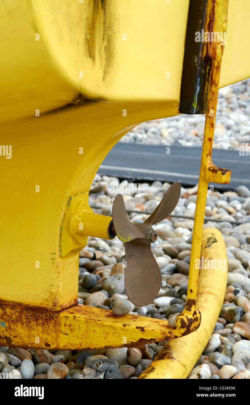 Yellow fishing boat showing the propeller and part of the rudder Stock ...