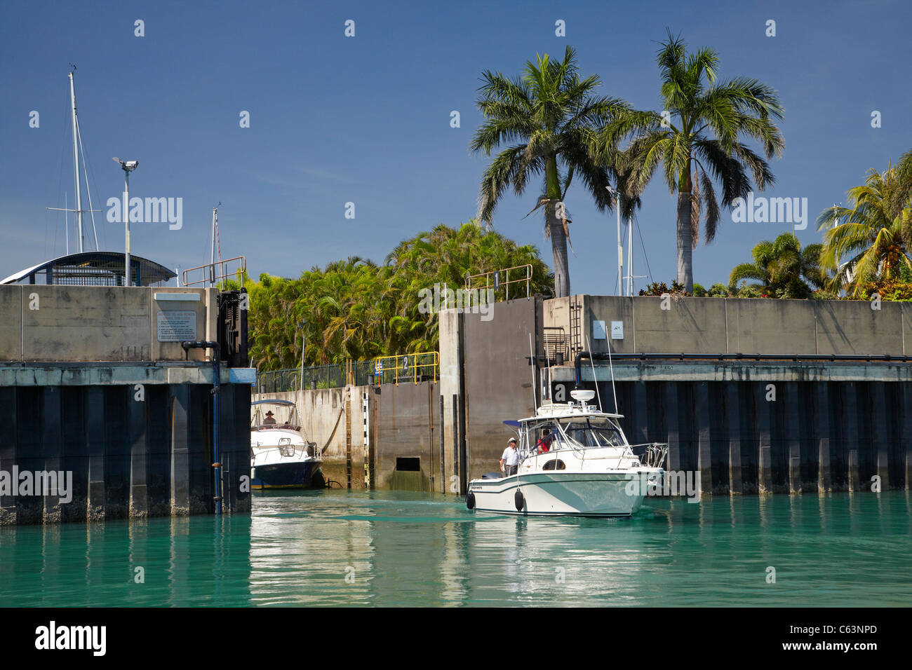 Launch exiting tidal lock, Cullen Bay Marina, Darwin, Northern ...