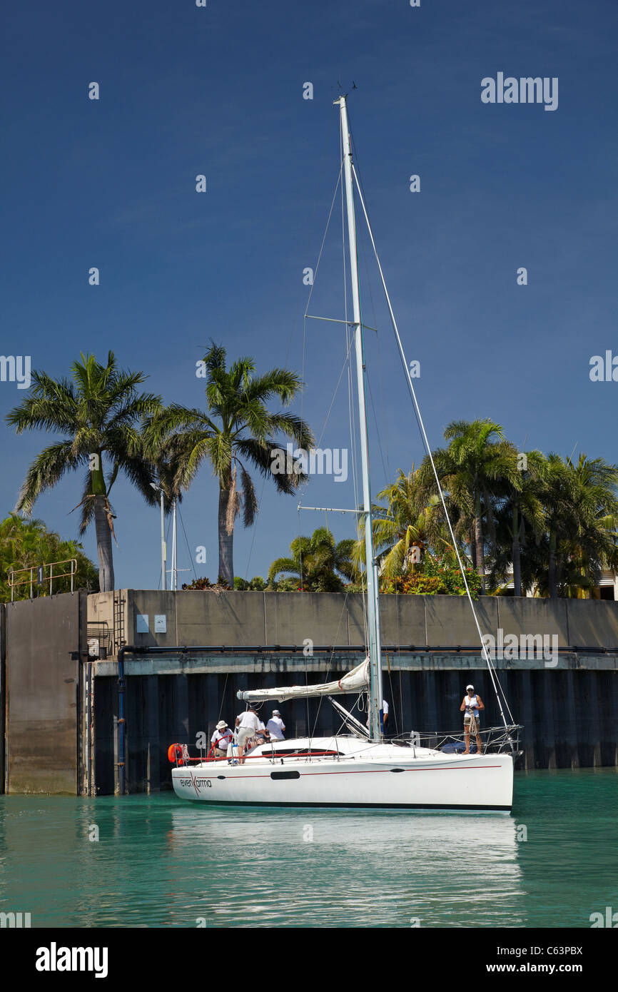 Yacht exiting tidal lock, Cullen Bay Marina, Darwin, Northern Territory ...