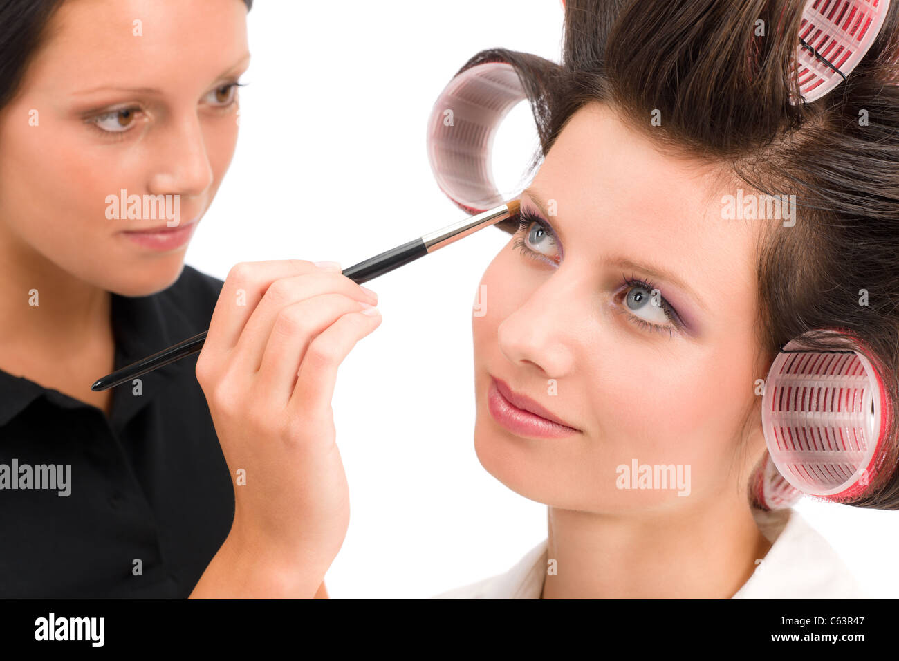 Make-up artist woman fashion model apply eyeshadow with brush Stock ...