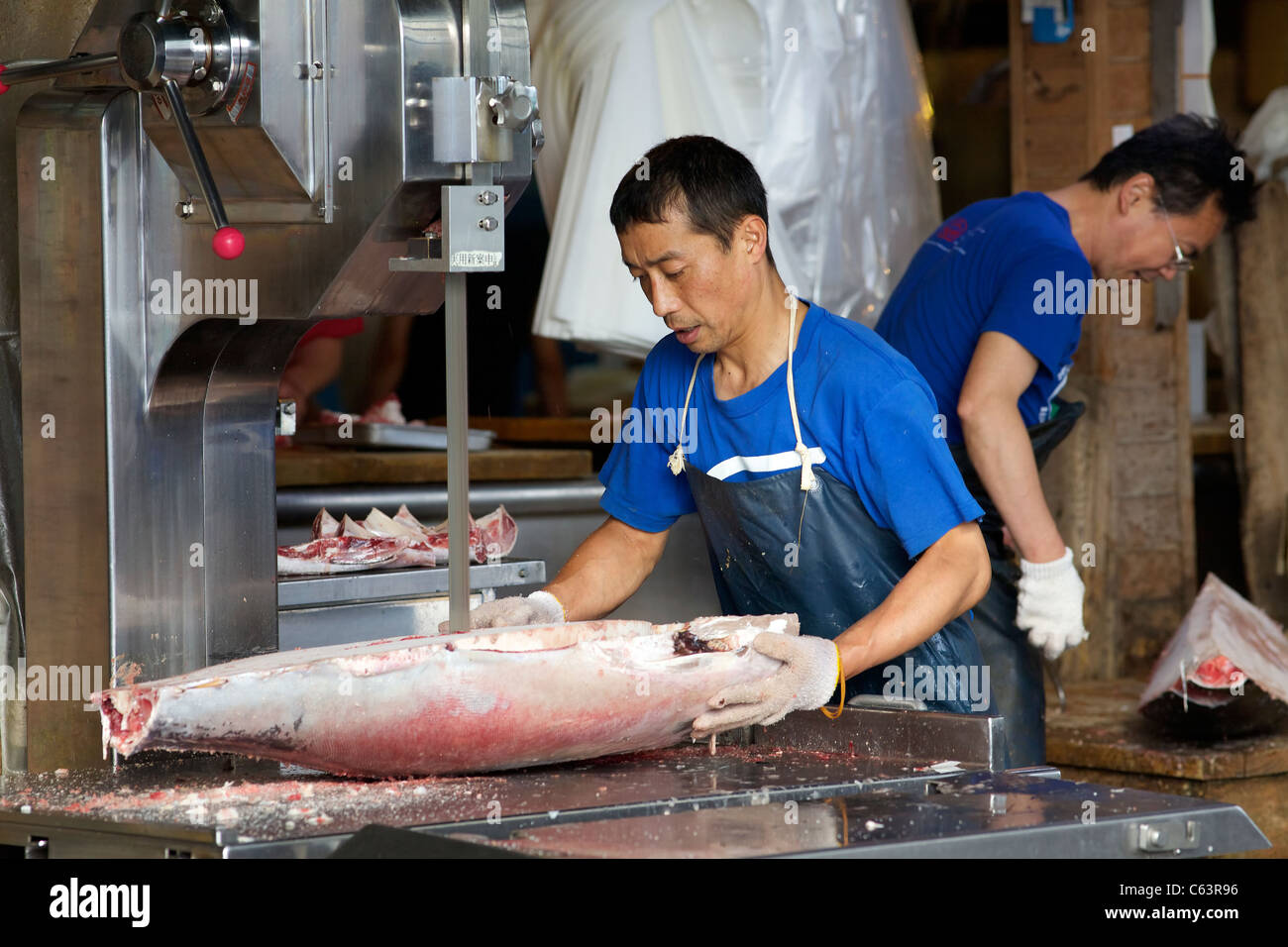 Workers processing Tuna at the Tsukiji Wholesale Seafood and Fish ...