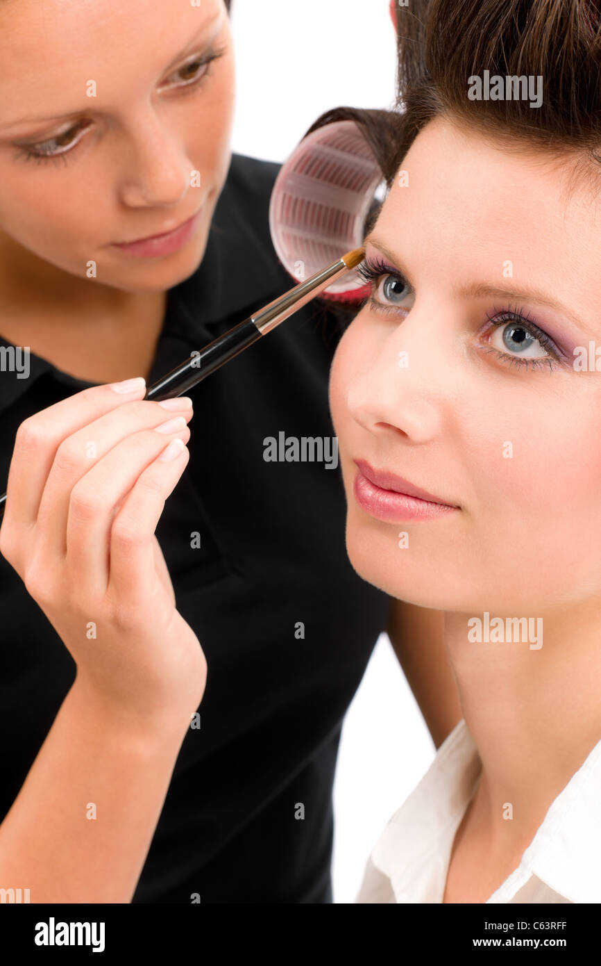 Make-up artist woman fashion model apply eyeshadow with brush Stock ...