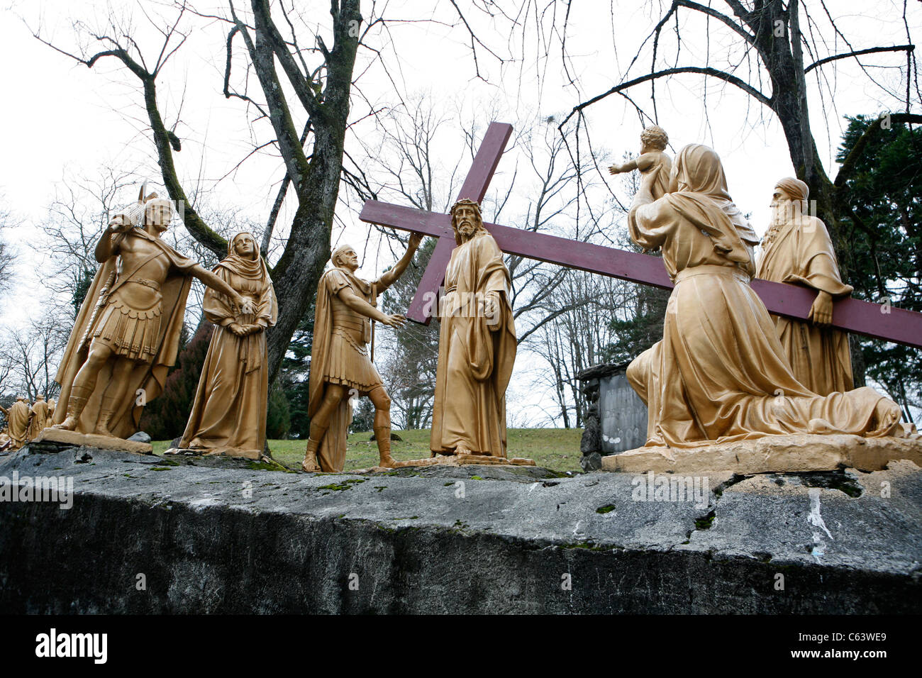 Lourdes in winter: Jesus Christ with the cross, crying Maria ...