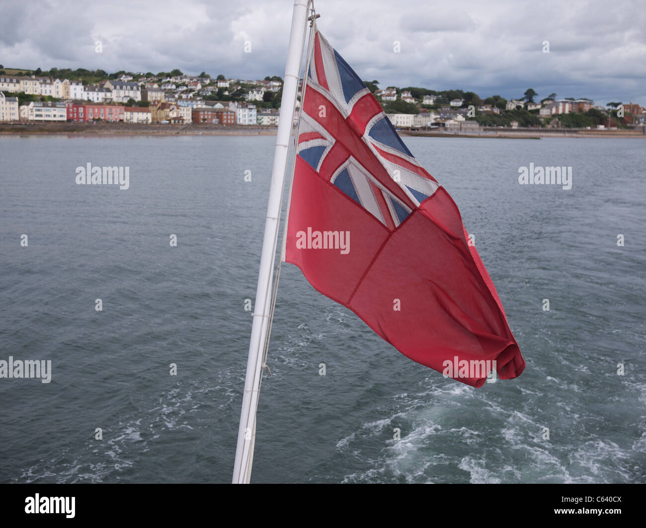Red Duster Flag on the back of a boat, Dawlish, Devon Stock Photo - Alamy