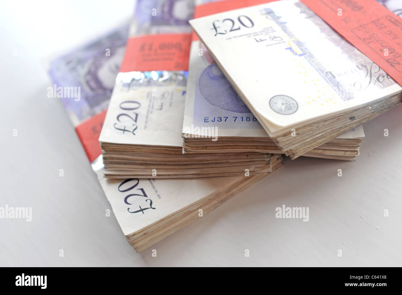 Wads of British sterling £20 notes twenties Stock Photo - Alamy