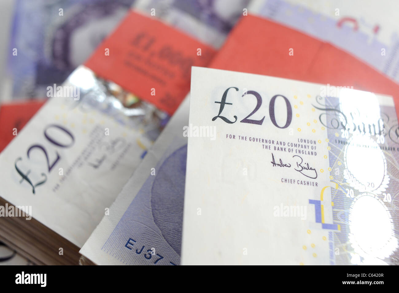Wads of British sterling £20 notes twenties Stock Photo - Alamy