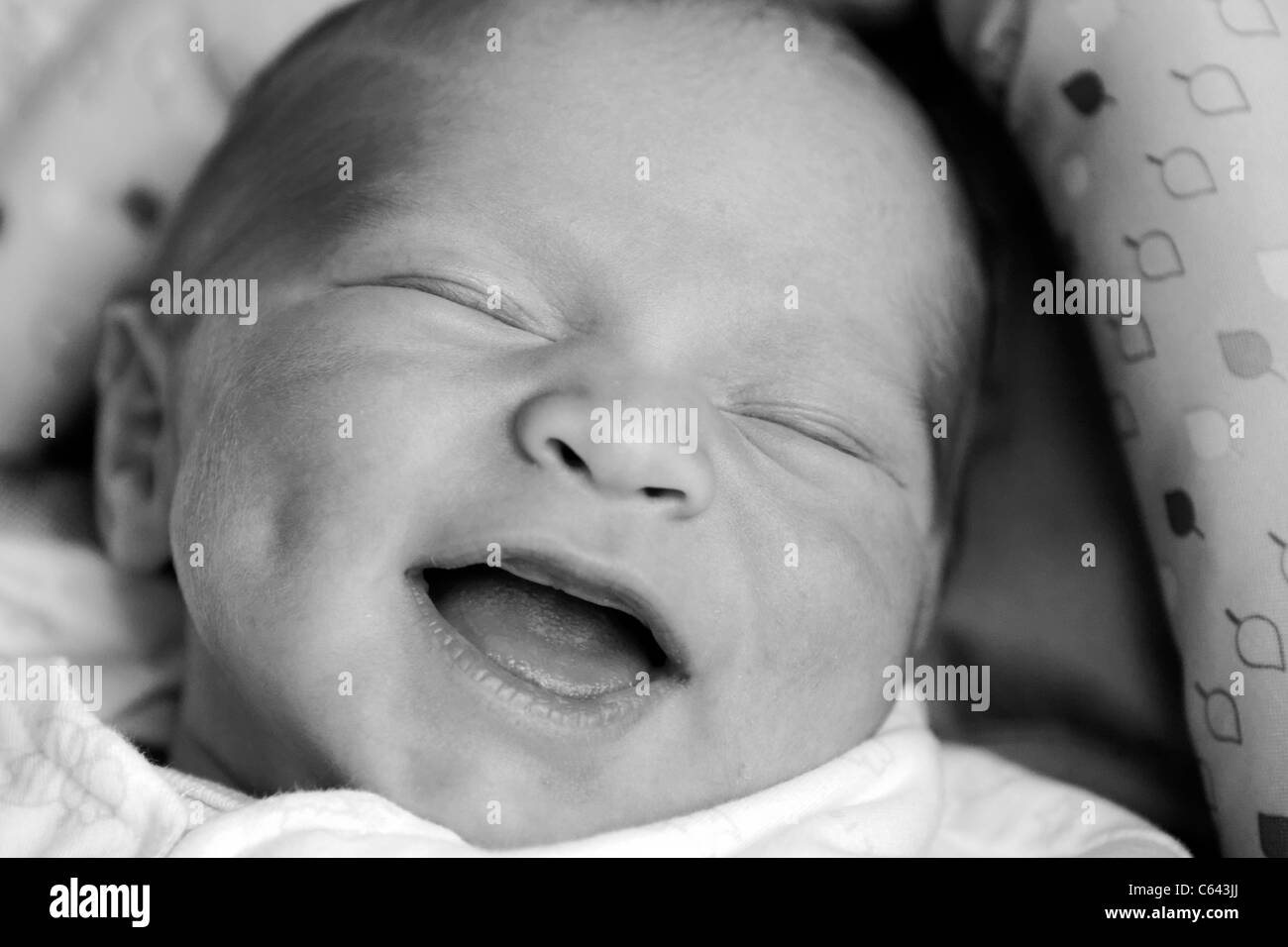 A smiling newborn Stock Photo - Alamy