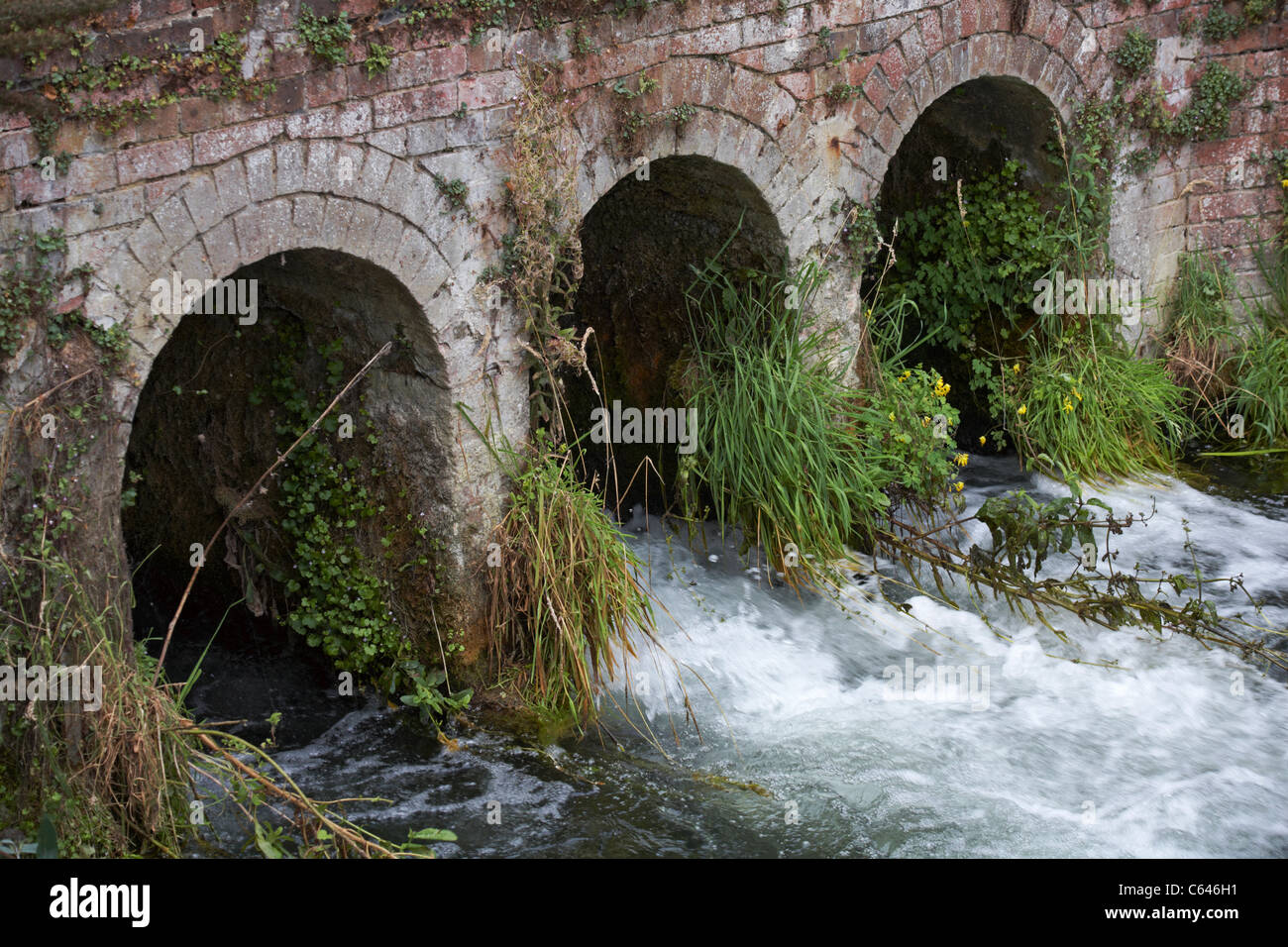 Water from the River Test flowing under the bridge by Sadler's Mill at ...