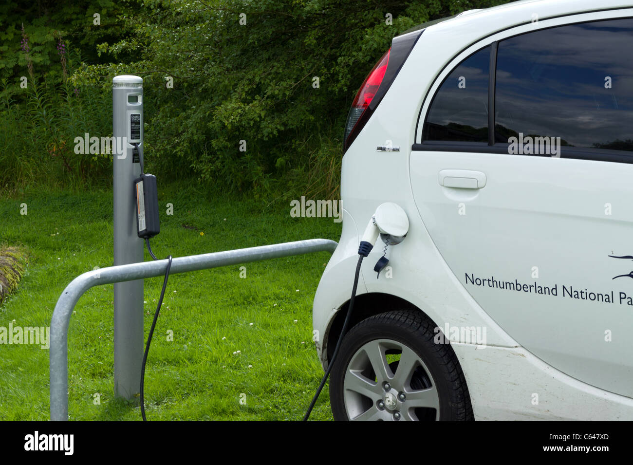 Electric powered car recharging. UK Stock Photo - Alamy