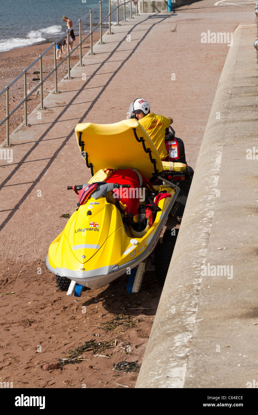 RNLI lifeguard reversing his jet-ski onto a beach Stock Photo - Alamy