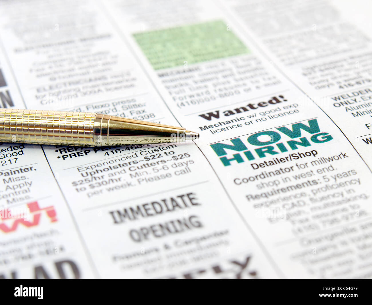 Pen on the newspaper career opportunity ad Stock Photo - Alamy