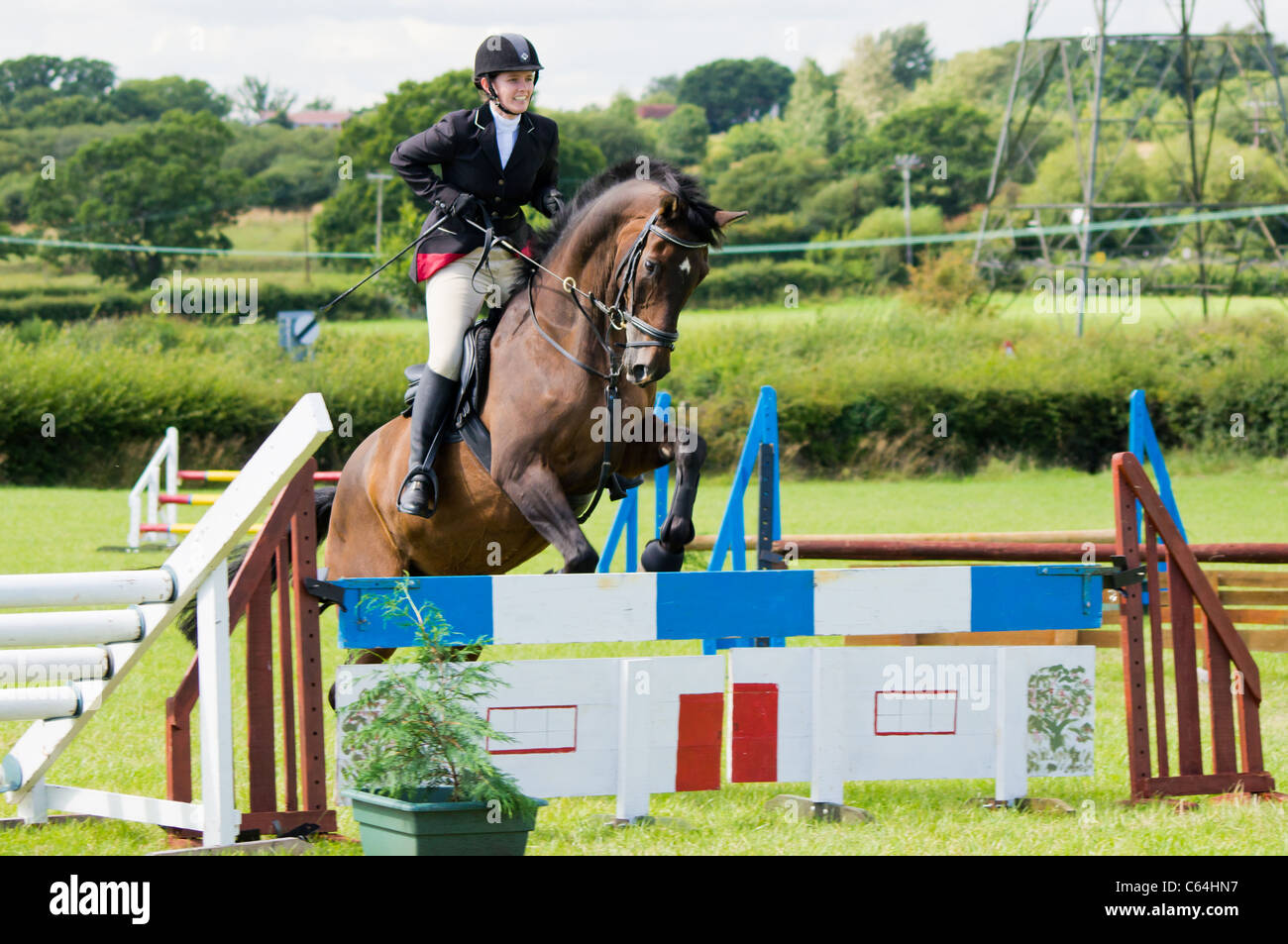 Horse and rider show jumping Stock Photo - Alamy