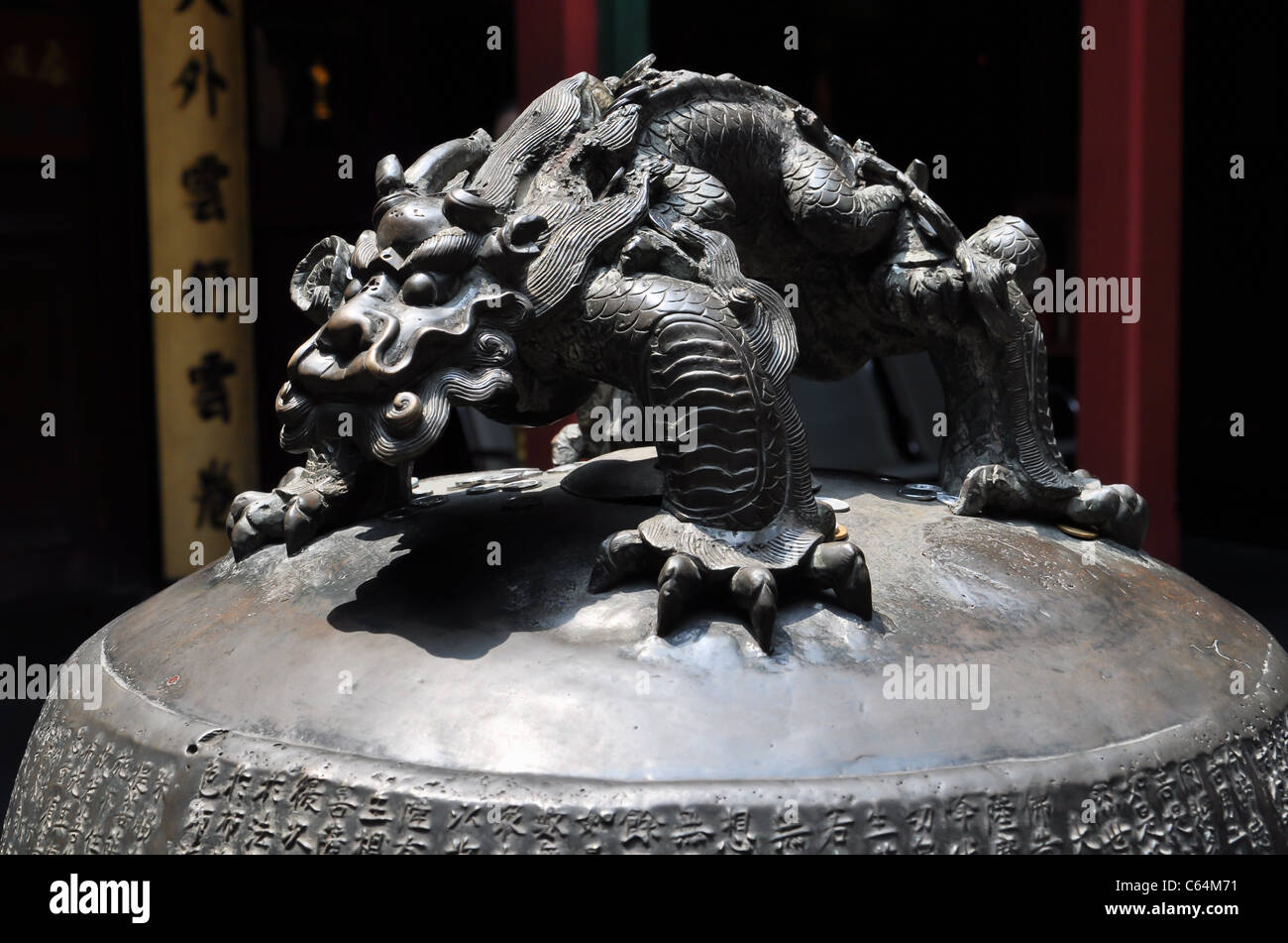 detailed close up of a chinese fable animal atop an ornamental bronze ...