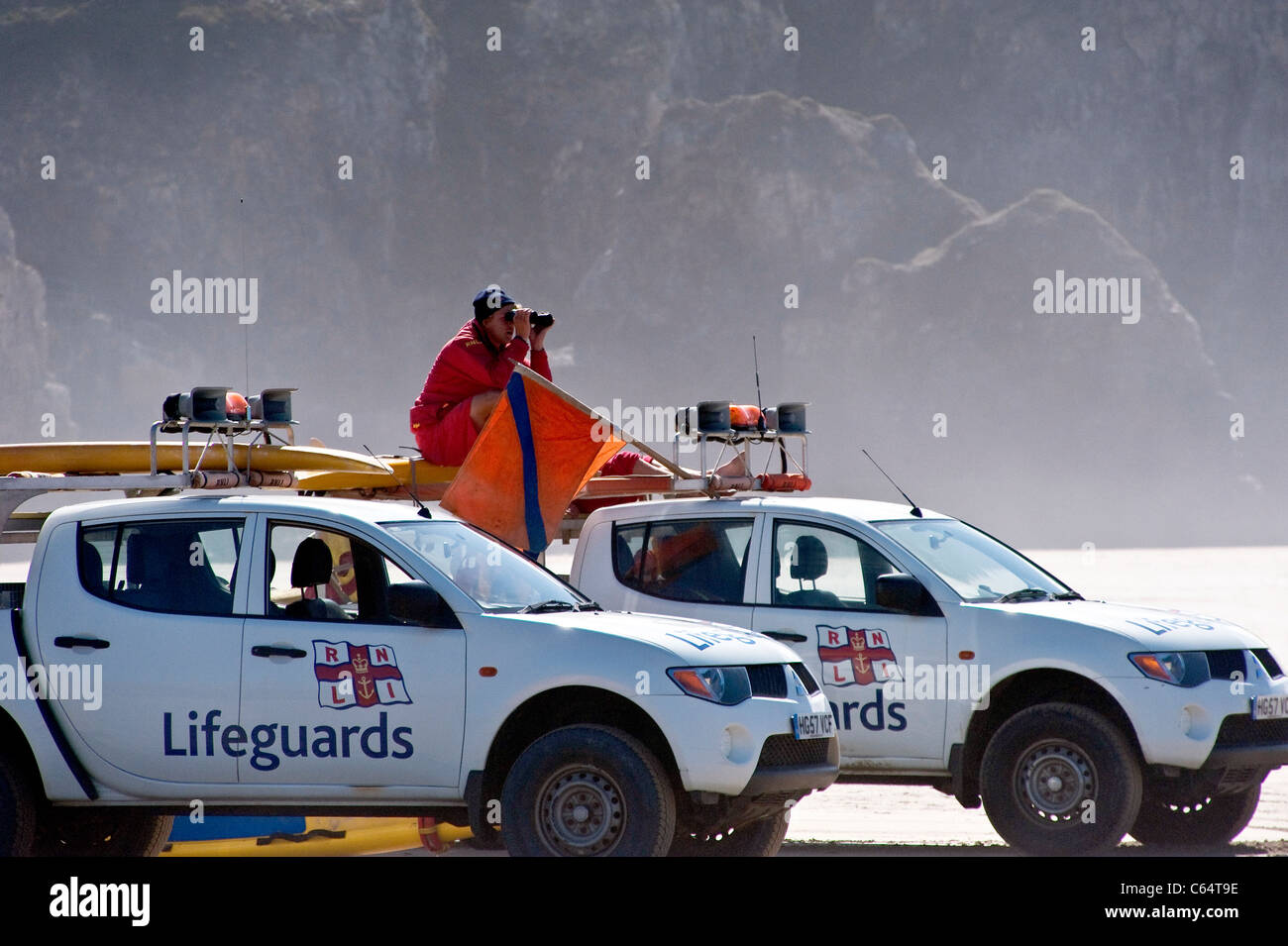 RNLI volunteer beach lifeguard at Perranporth, a popular coastal resort ...